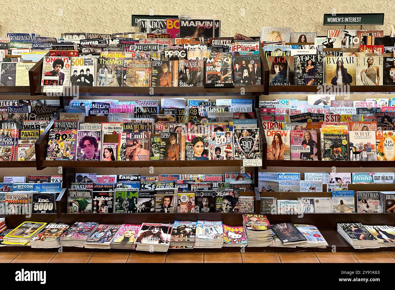 A view of current event magazines on display shelves at the Barnes and ...