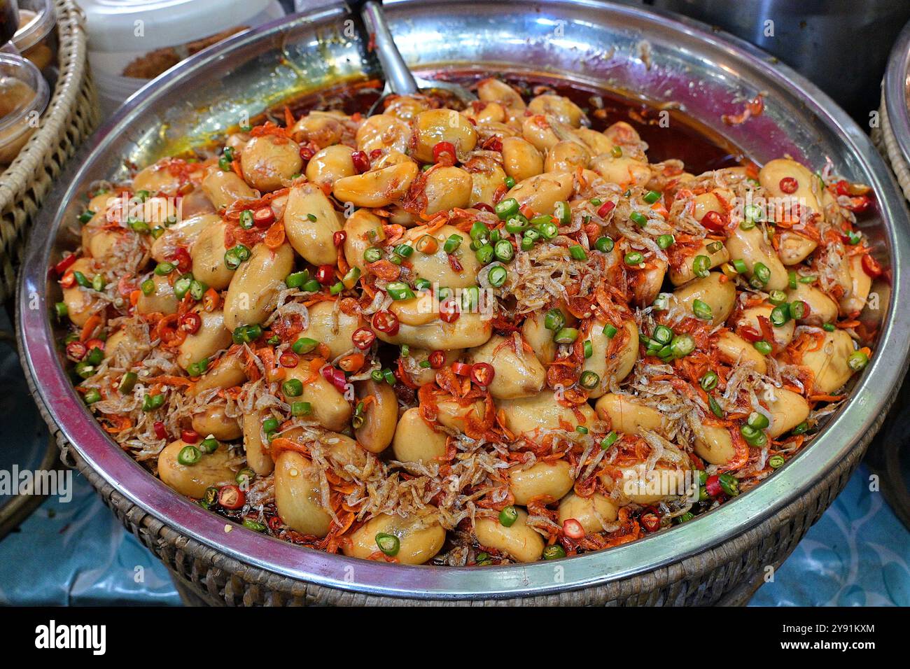 Platter of pickled ripe Thai marian plums, Bouea macrophylla, for sale ...