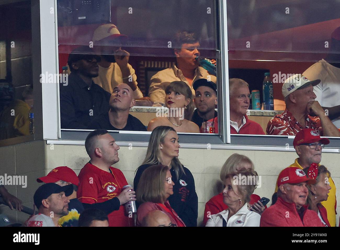 October 7, 2024: Taylor Swift, center, watches a game between the ...
