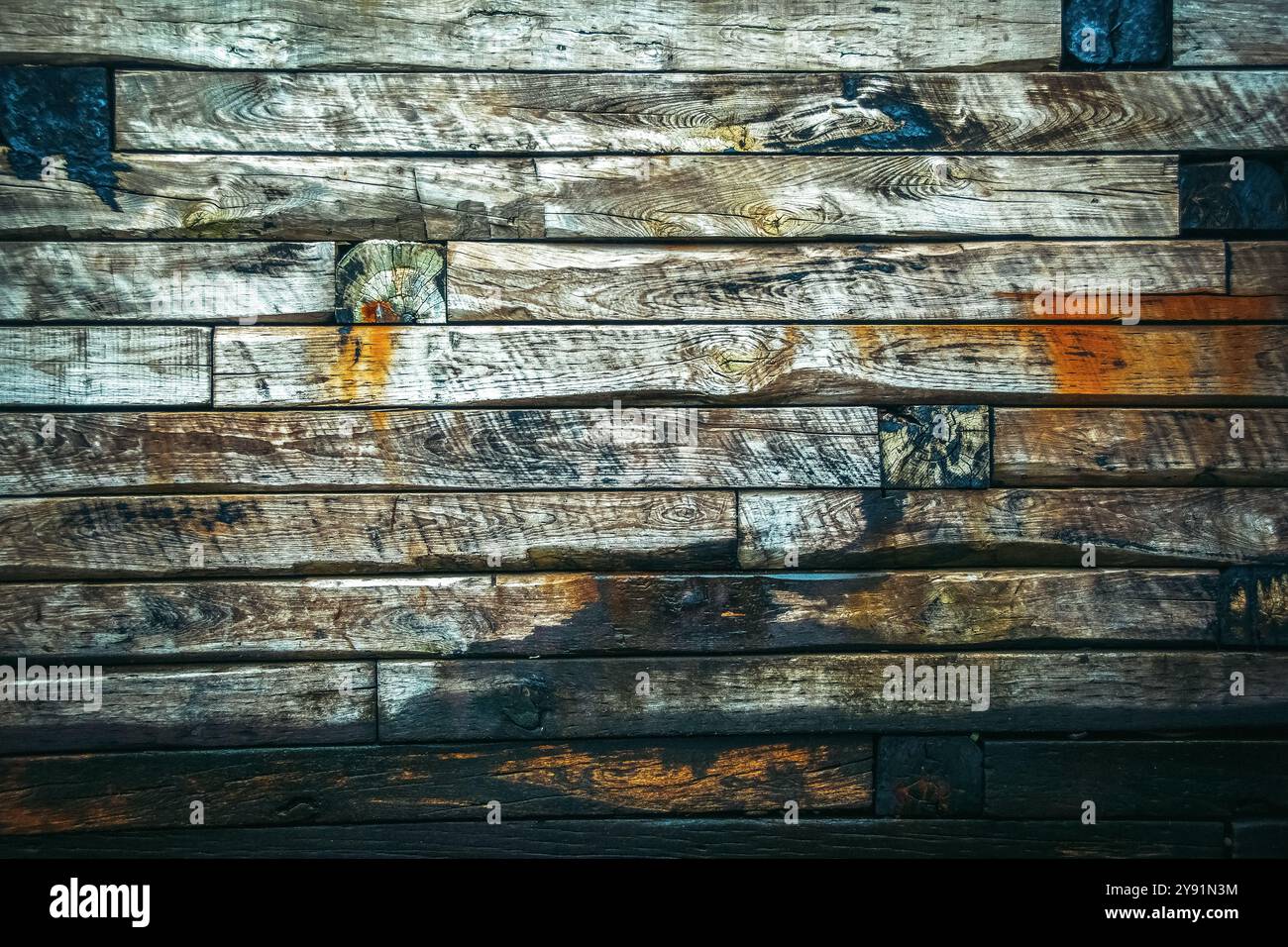 Photography of a section of the wall of a wharf. Tar, woodgrain ...