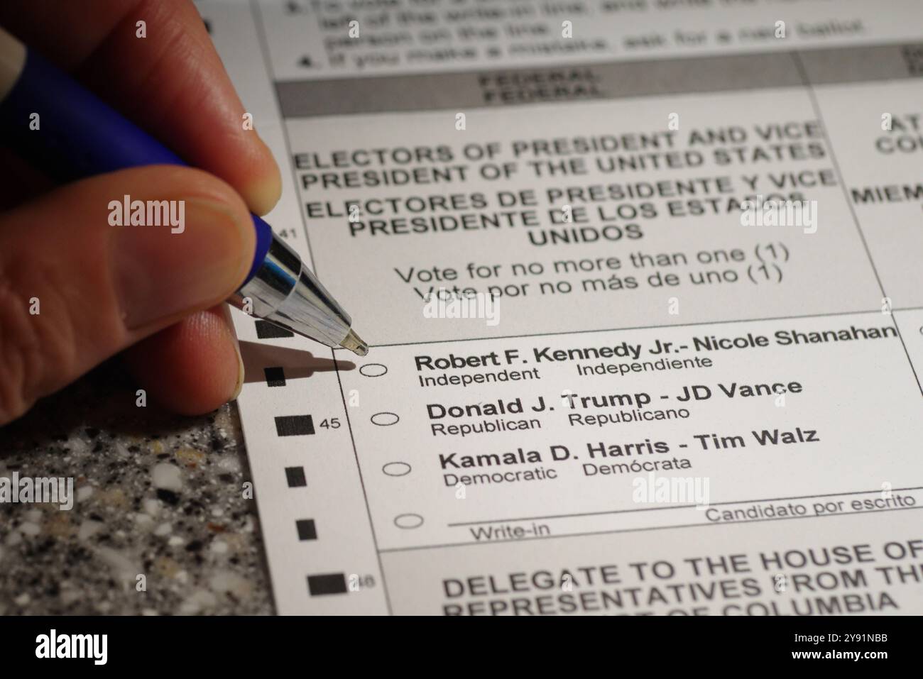 Washington, DC, USA. 7 Oct 2024. Filling out a mail-in ballot for the ...