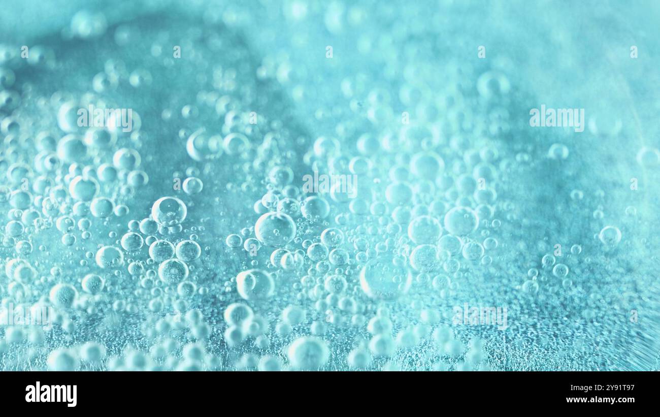 Water bubbles. Oil fluid. Defocused clear blue color fluid swirl wet ...