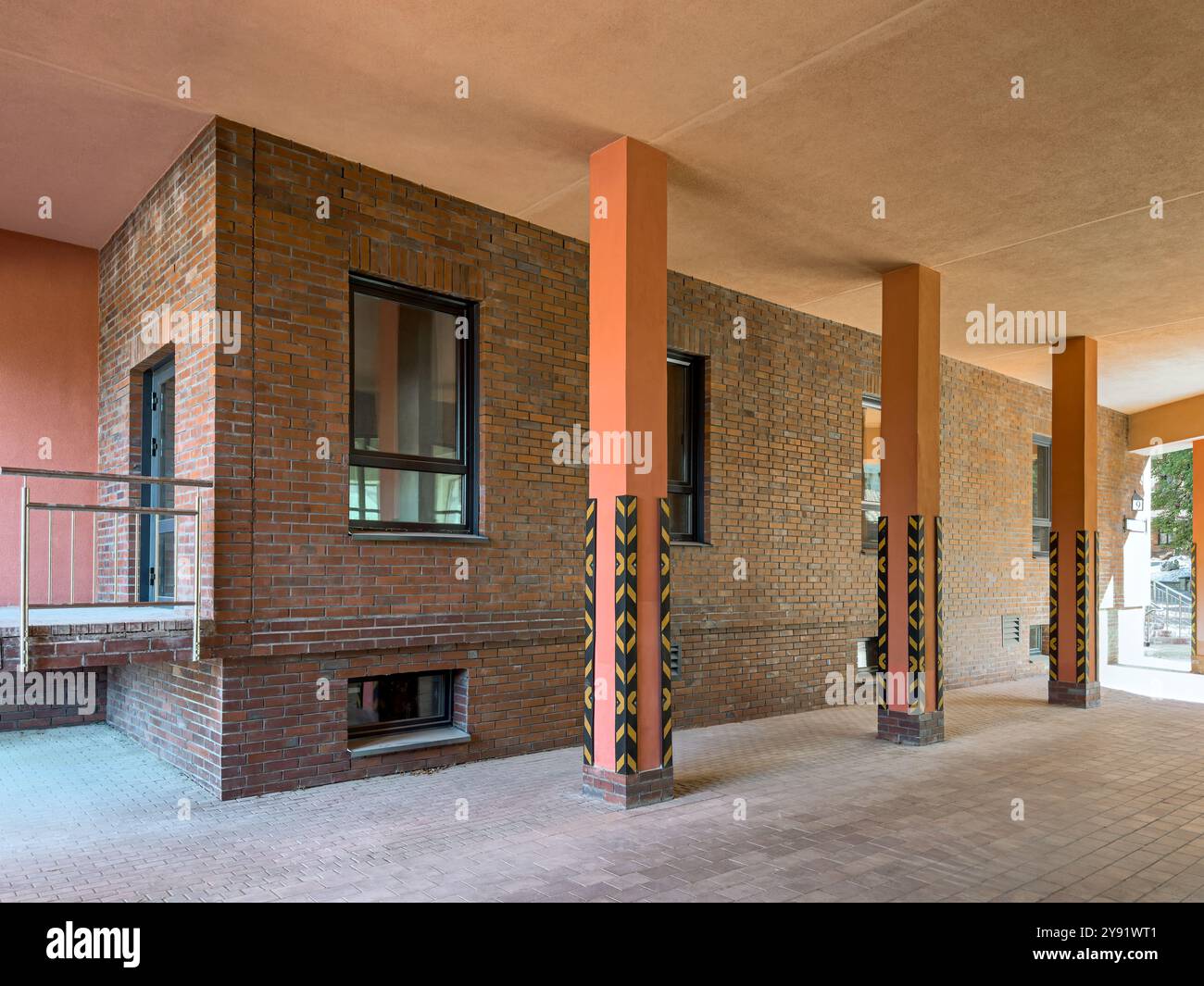 entrance of courtyard. pillars in arch equipped with corner protection ...