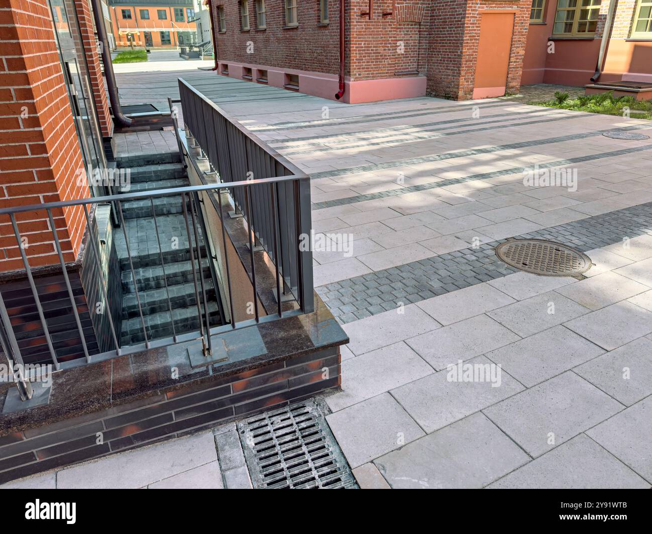 courtyard of a complex of industrial buildings after renovation. modern ...