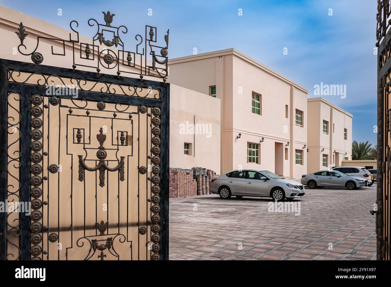 Houses Villa's with parked cars outdoor in the Middle East. Exterior of ...