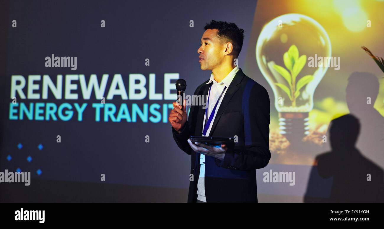 Podium, presenter and man at seminar with microphone, presentation and ...