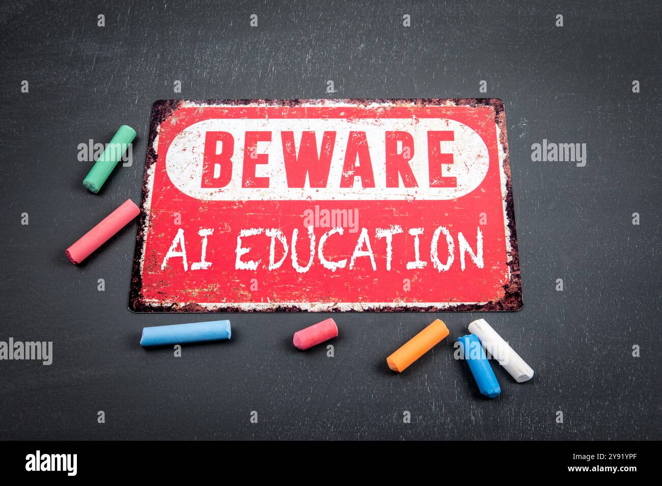 Ai education. Beware sign with text and colored pieces of chalk on a ...