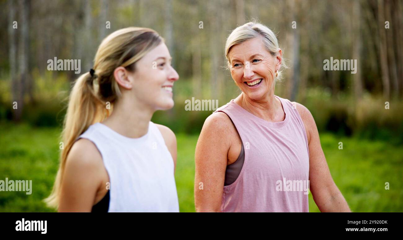Mother, daughter or talking in forest with hiking for fitness adventure ...