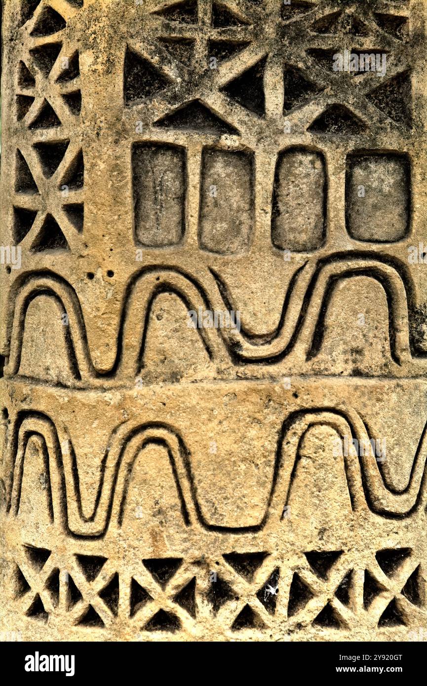Megalithic carving on a tomb in traditional village of Pasunga in ...