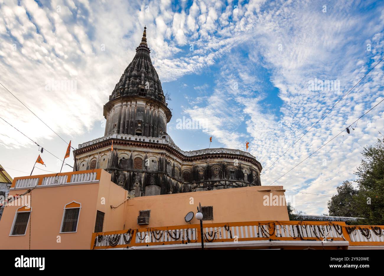Sacred Hindu temple with its vibrant architecture and dramatic sky at ...