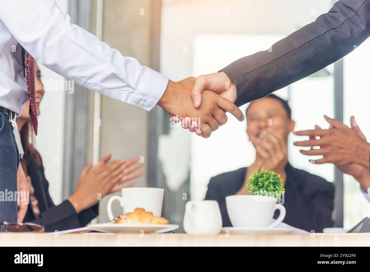 Team Business Partners shaking hands together to Greeting Start up ...
