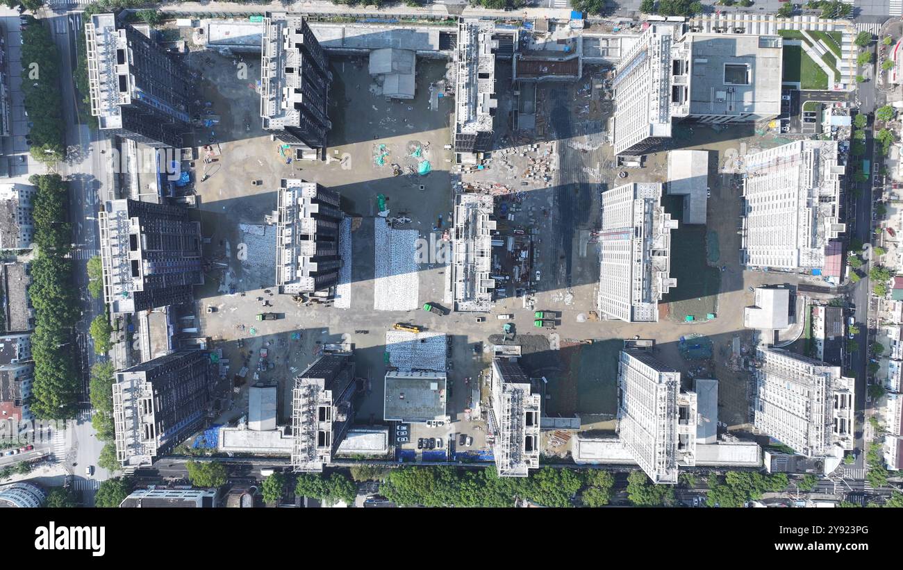 TAICANG, CHINA - OCTOBER 8, 2024 - Construction workers work on a roof ...
