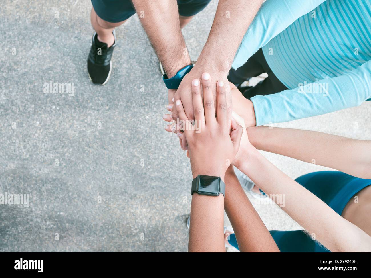 Fitness, group and hands together on road with exercise, motivation and ...