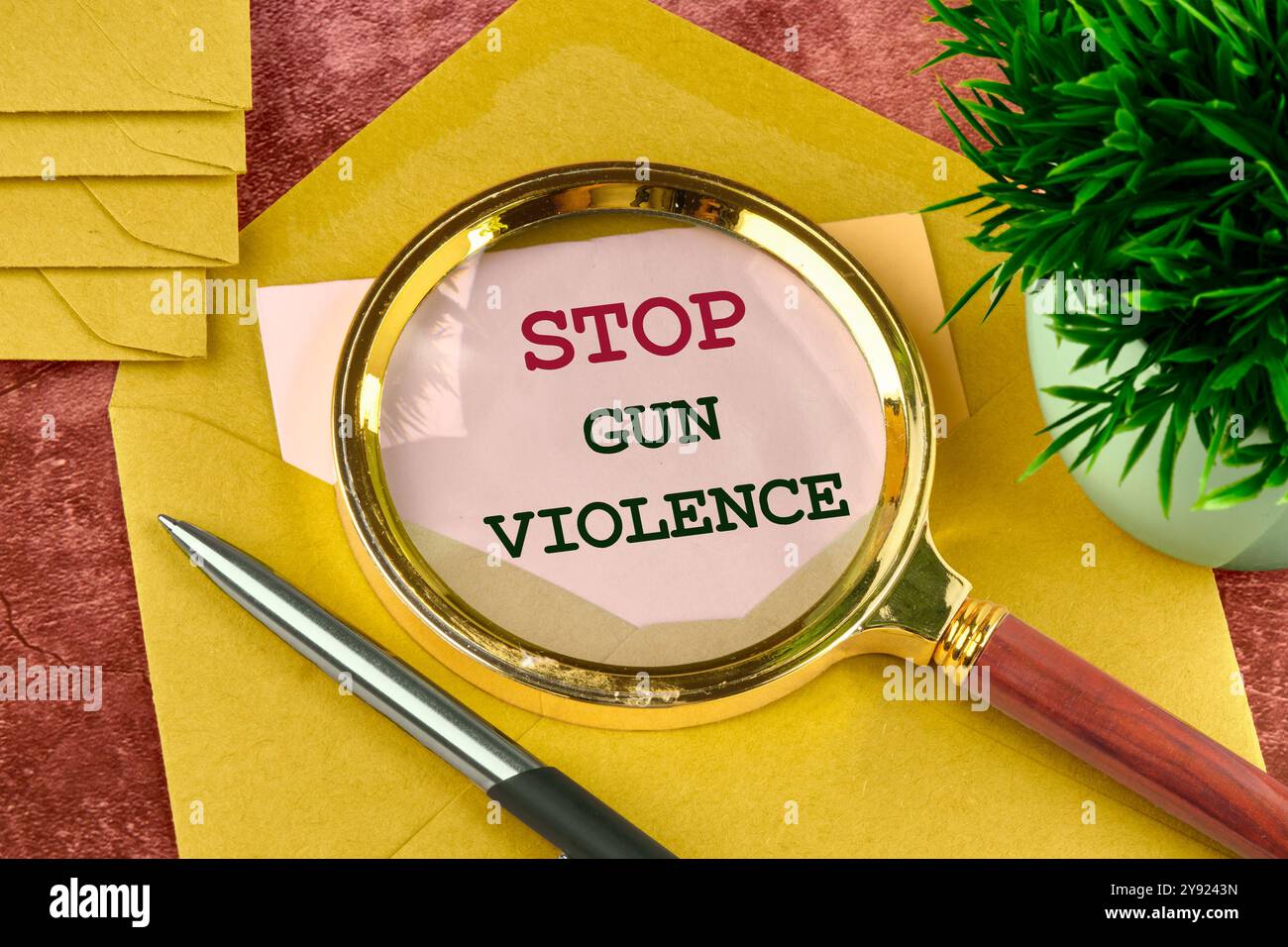 STOP GUN VIOLENCE text written on a piece of paper from an envelope in ...