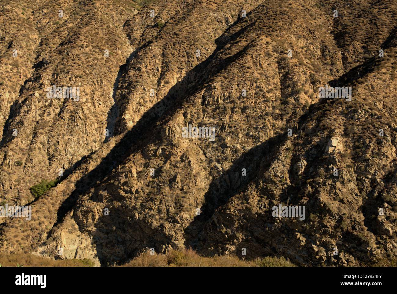detail of Eastern Sierra mountain hillside show ridges, depth, texture ...