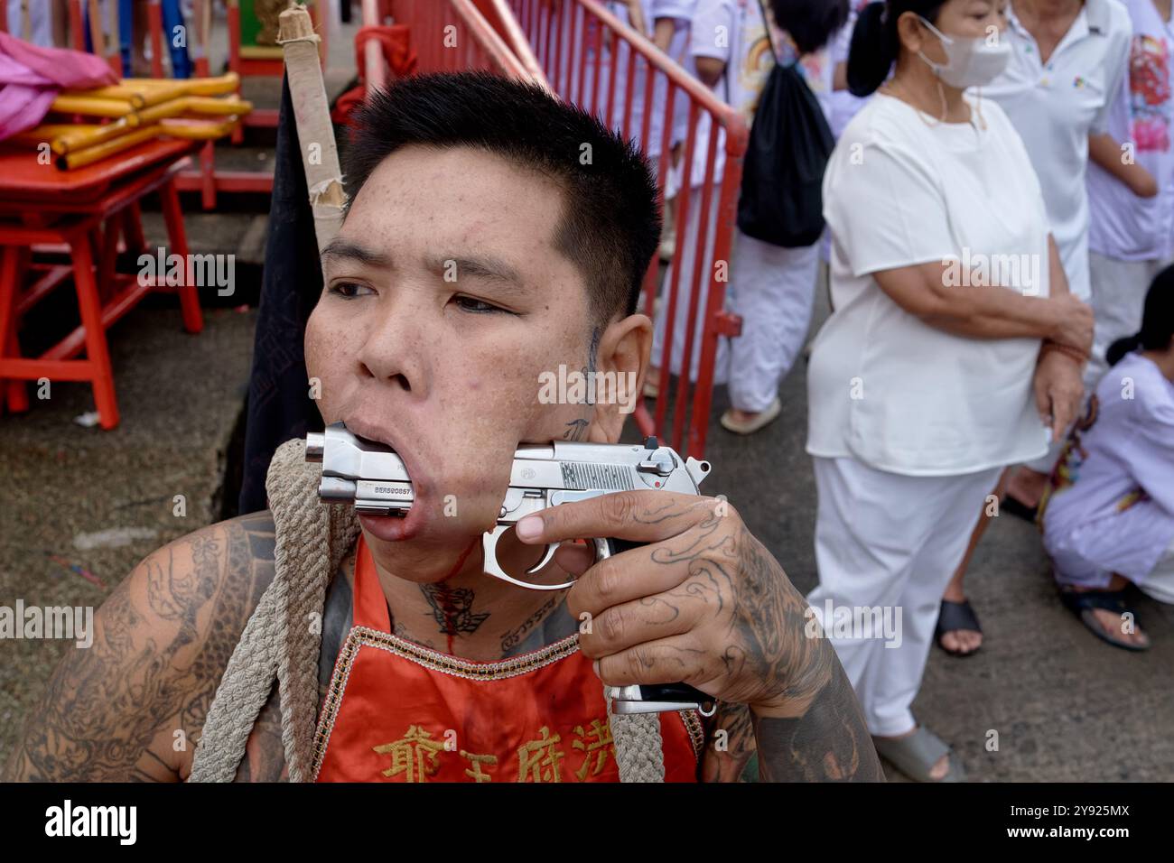 During the annual, gory Vegetarian Festival in Phuket Town, Thailand, a ...