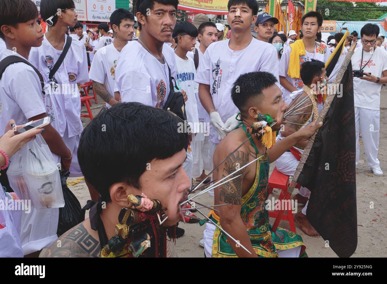 During the Vegetarian Festival in Phuket Town, Thailand, a group of ...