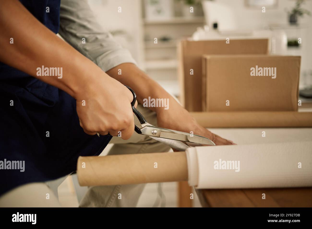 Fashion designer, cutting and hands with scissors, working and fabric ...