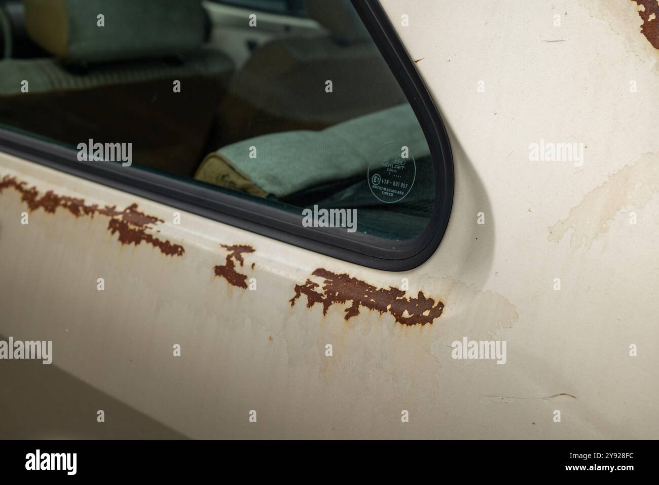 Old, rusted car body panels. Close up shot of rust patches on an old ...