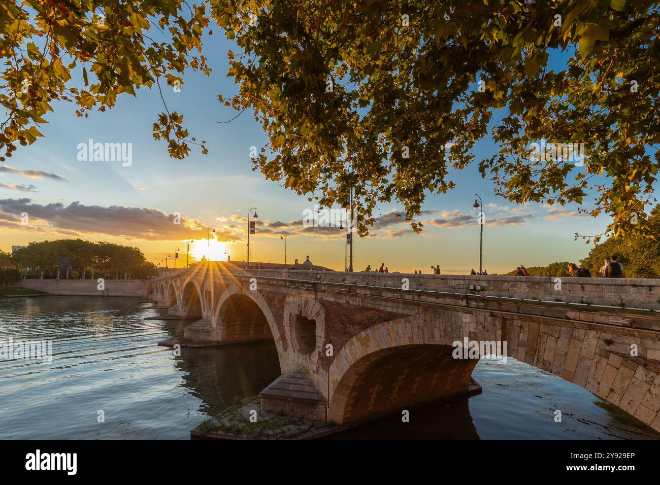 Golden sunset over the Garonne river and Pont Neuf in downtown Toulouse ...