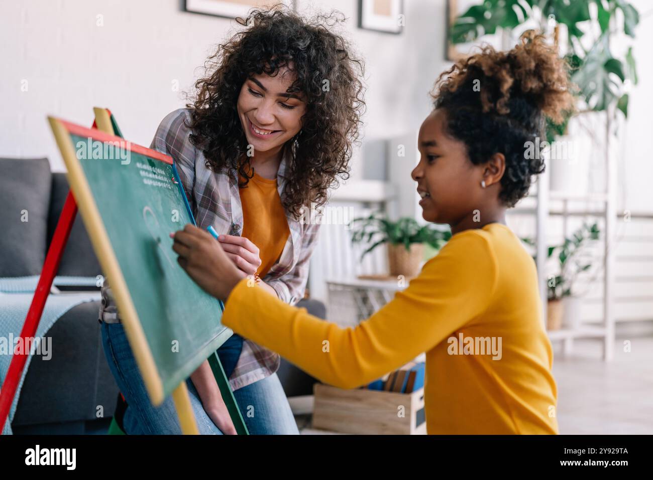 Multiethnic black diverse family teaching child. Home education family ...