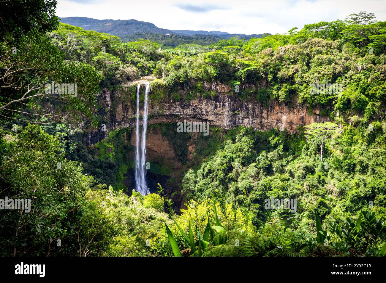 Spectacular view of the Chamarel Falls cascading over the edge of a ...