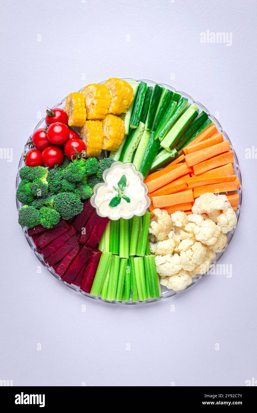 Colorful vegetable platter with celery, corn, broccoli, carrots ...