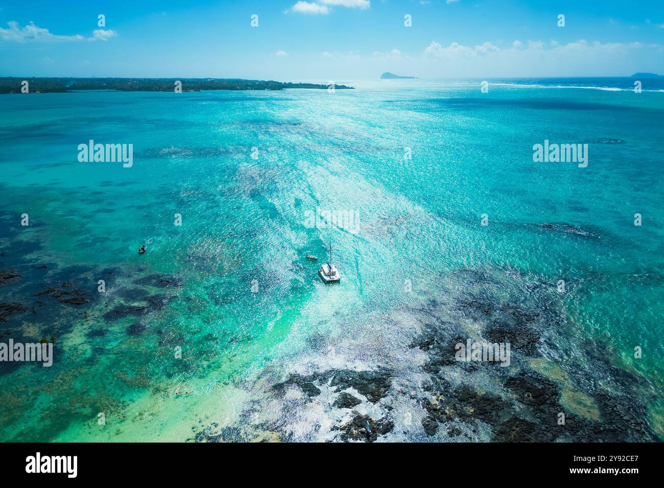 Great aerial view of a modern catamaran anchored off the island of L ...