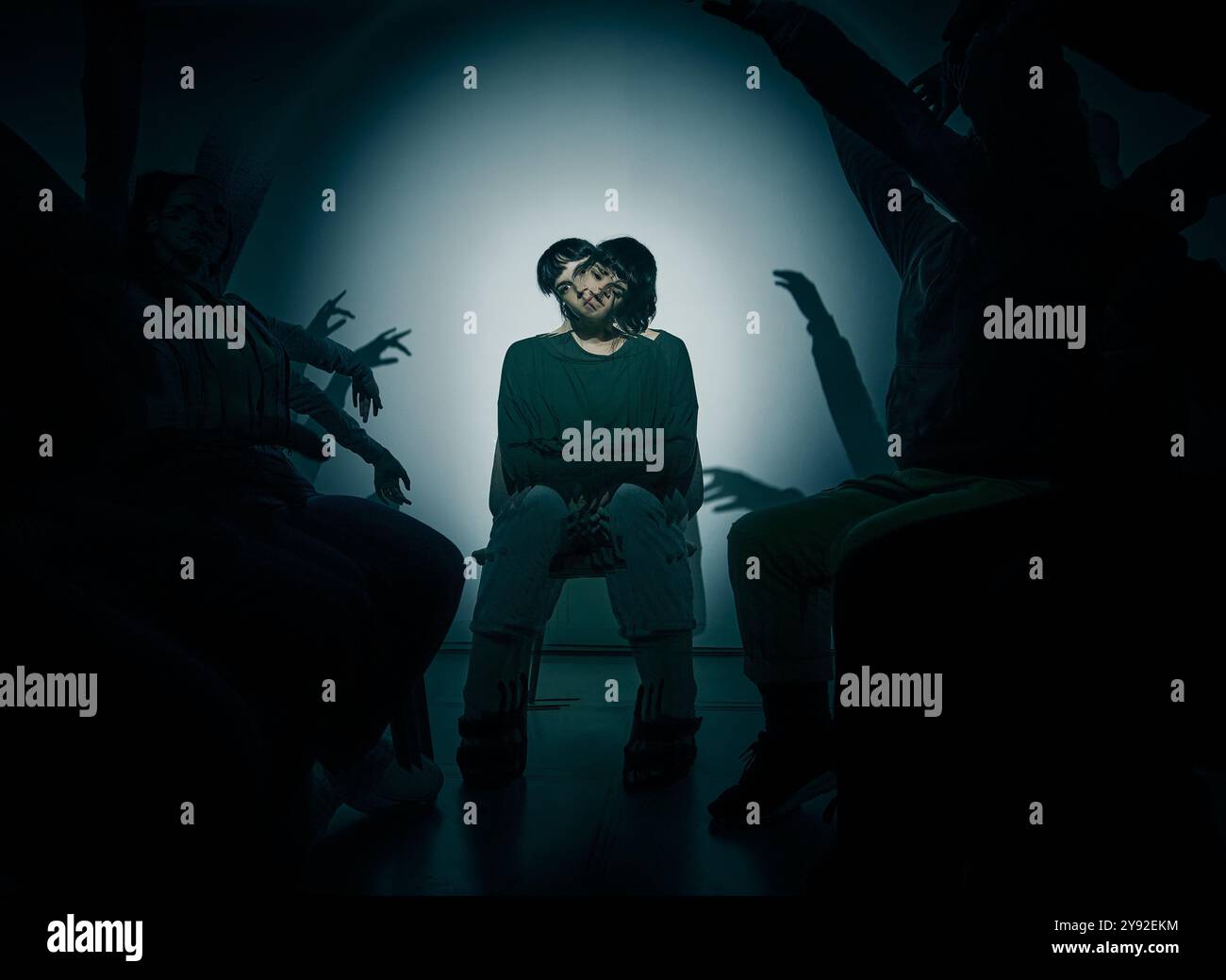 Bipolar, mental health and shadow with woman in studio on dark ...