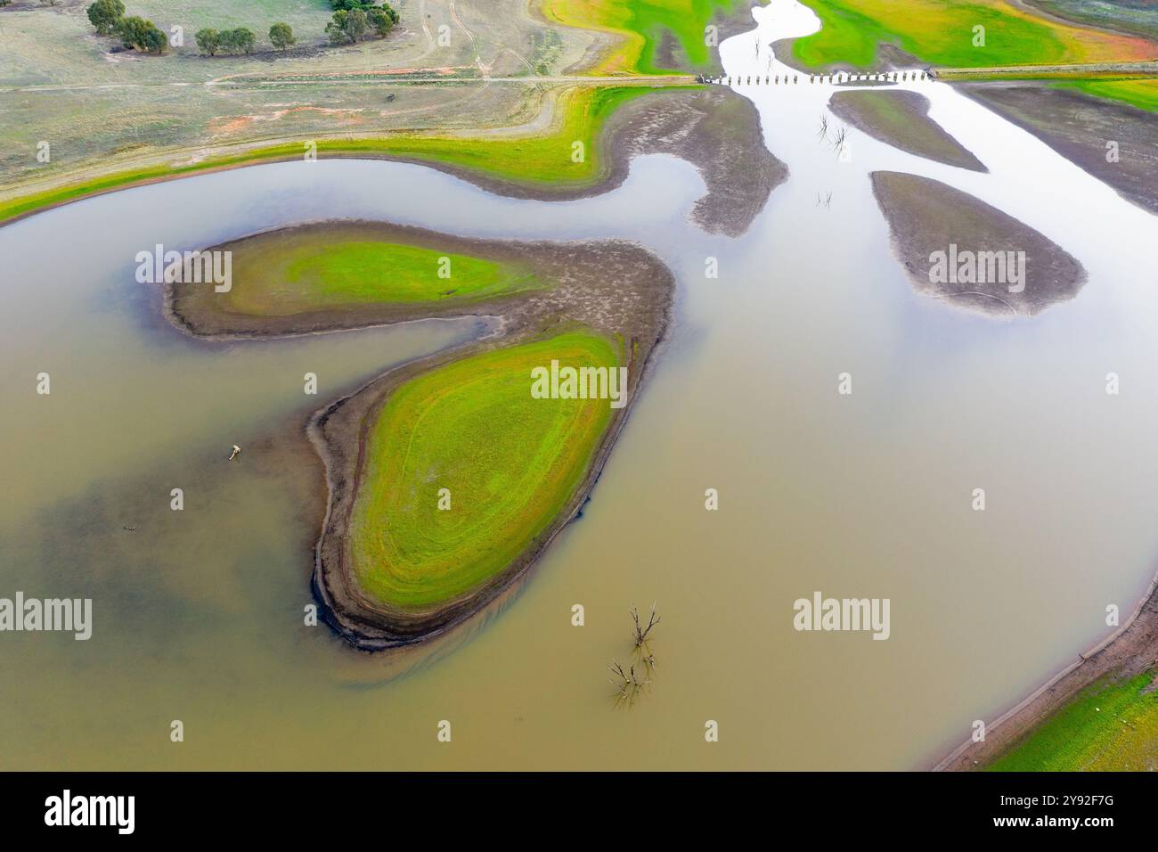 Aerial view of green islands in a drying river at Joyces Creek, Ciarn ...
