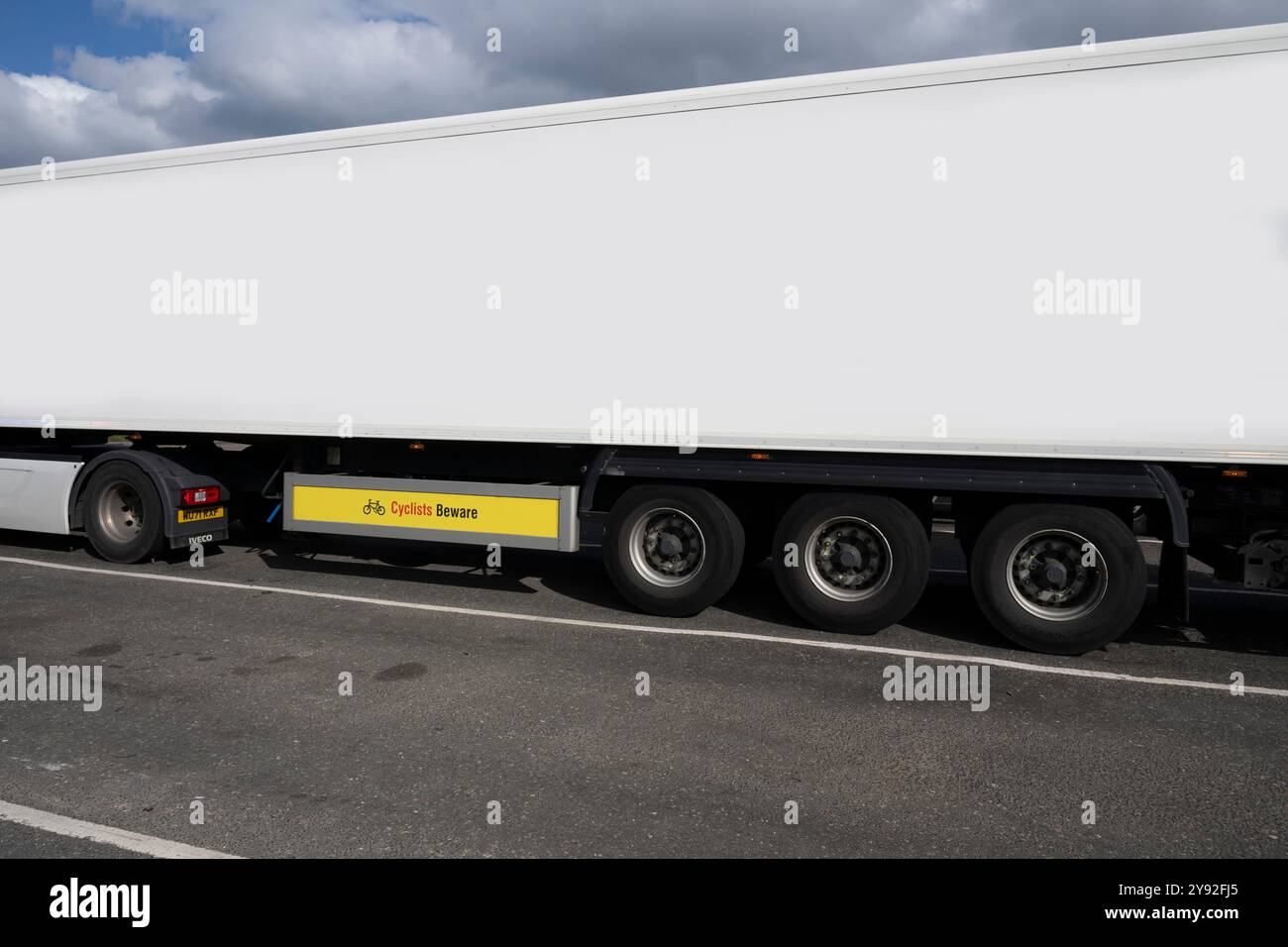 Lorry trailer with safety warning message for cyclists. Blank canvas ...