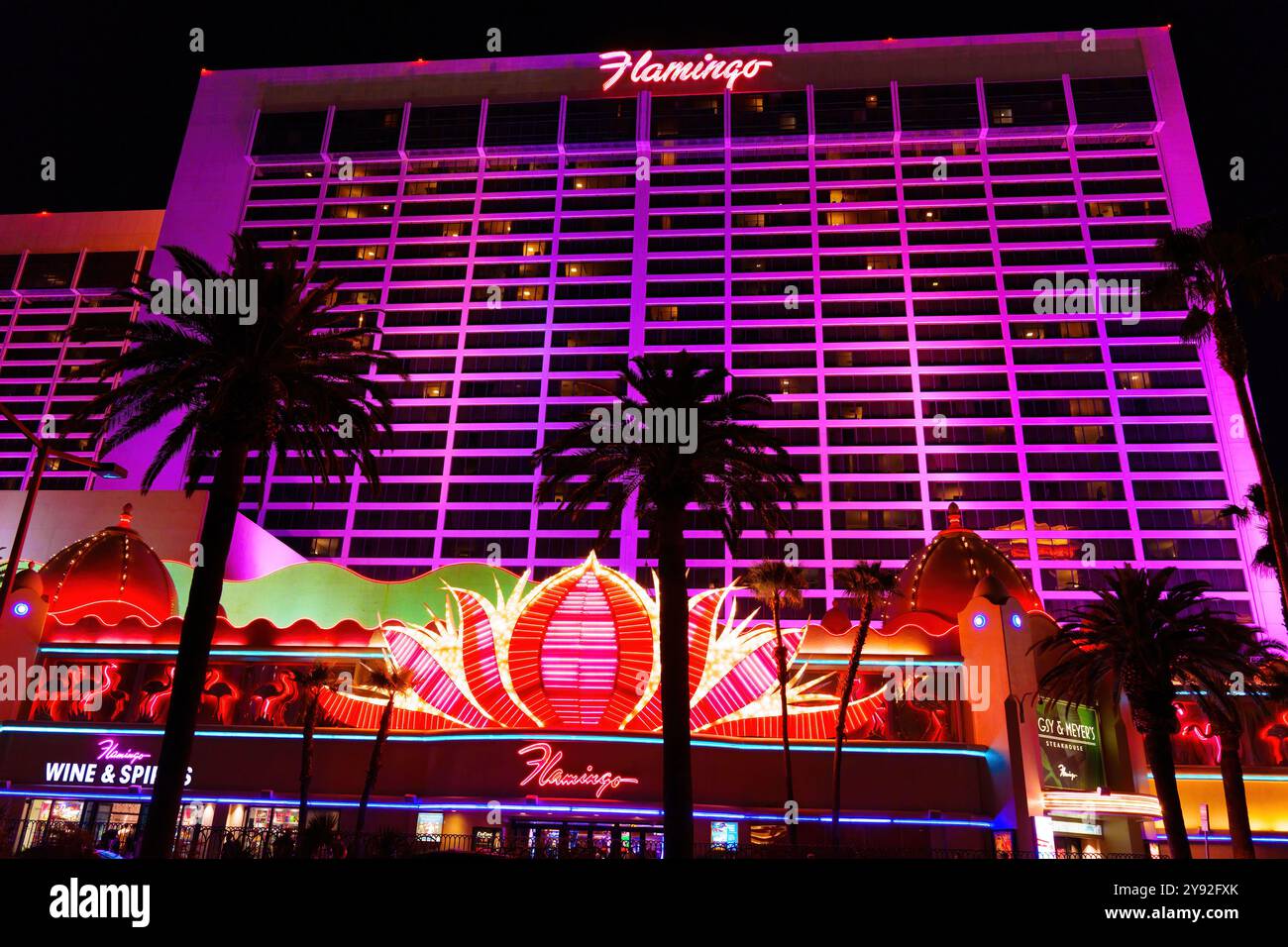 Las Vegas, Nevada - April 13, 2024: The Flamingo Hotel's vibrant neon lights and distinctive ...