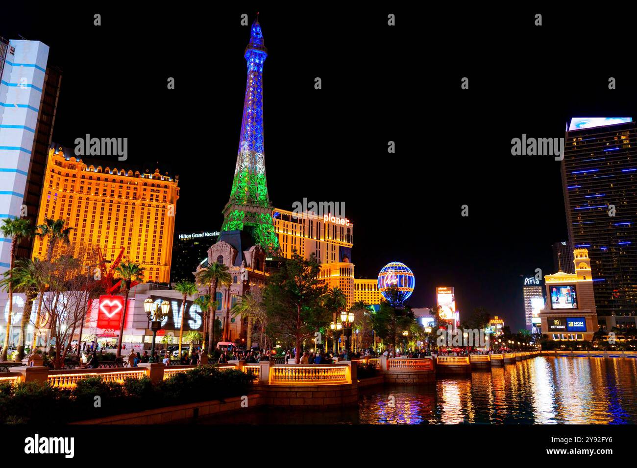 Las Vegas, Nevada - April 13, 2024: Colorful night view of Las Vegas Strip featuring the Eiffel ...