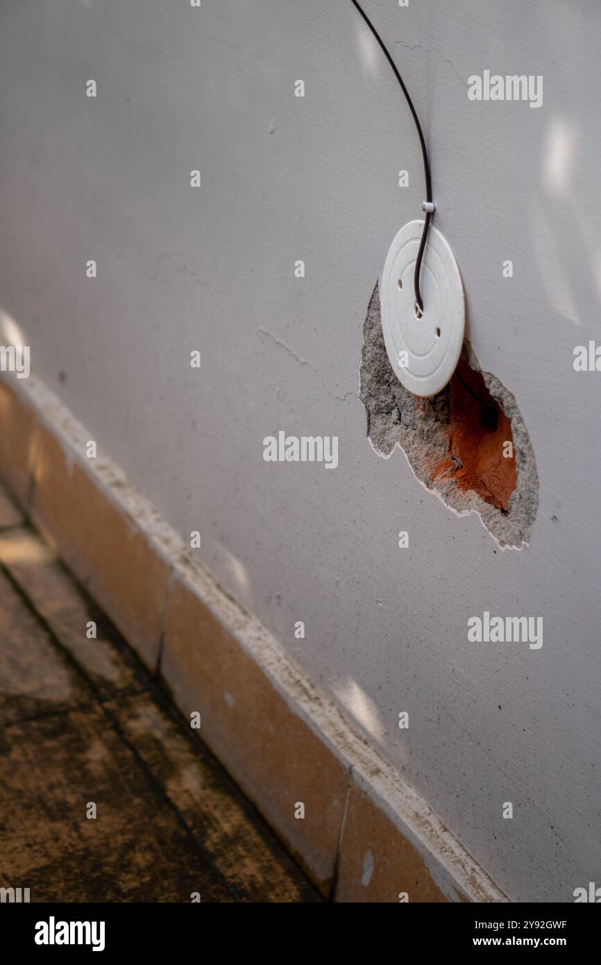 A breakthrough hole in a wall for cable wires and fiber optics ...