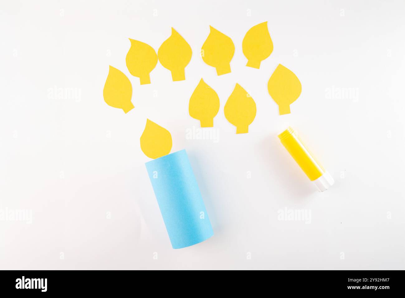 yellow flame shape piece attached to blue color tube, step in creative ...