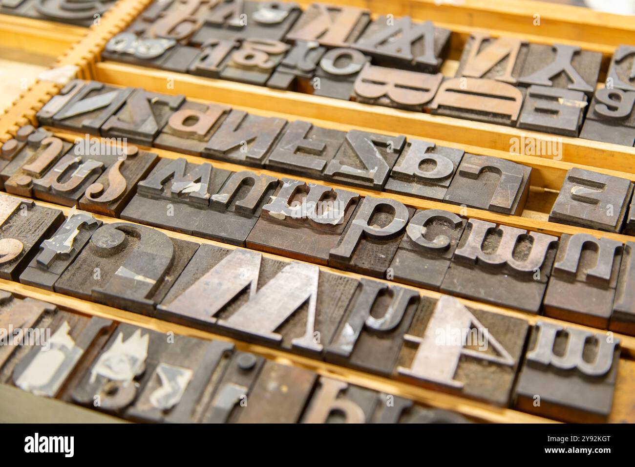 Metal block types letters of an old printing press, UK Stock Photo - Alamy
