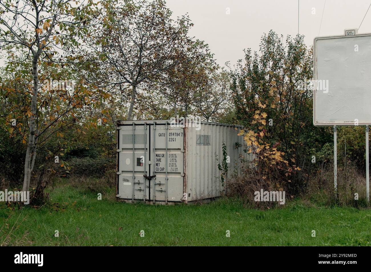 Old container abandoned in a forest Stock Photo - Alamy