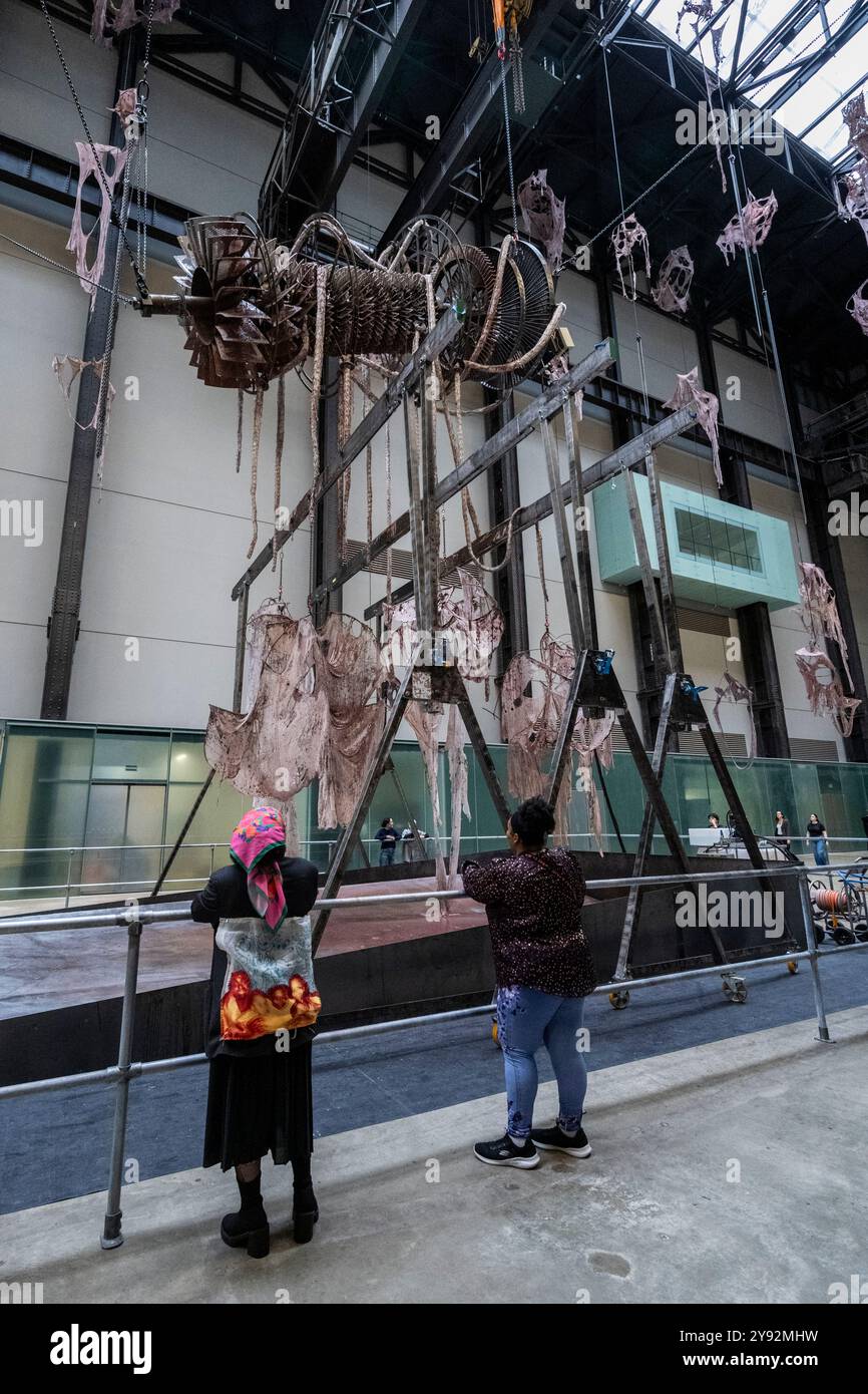 London, UK. 8 October 2024. Staff at the unveiling of ‘Open Wound’ by ...