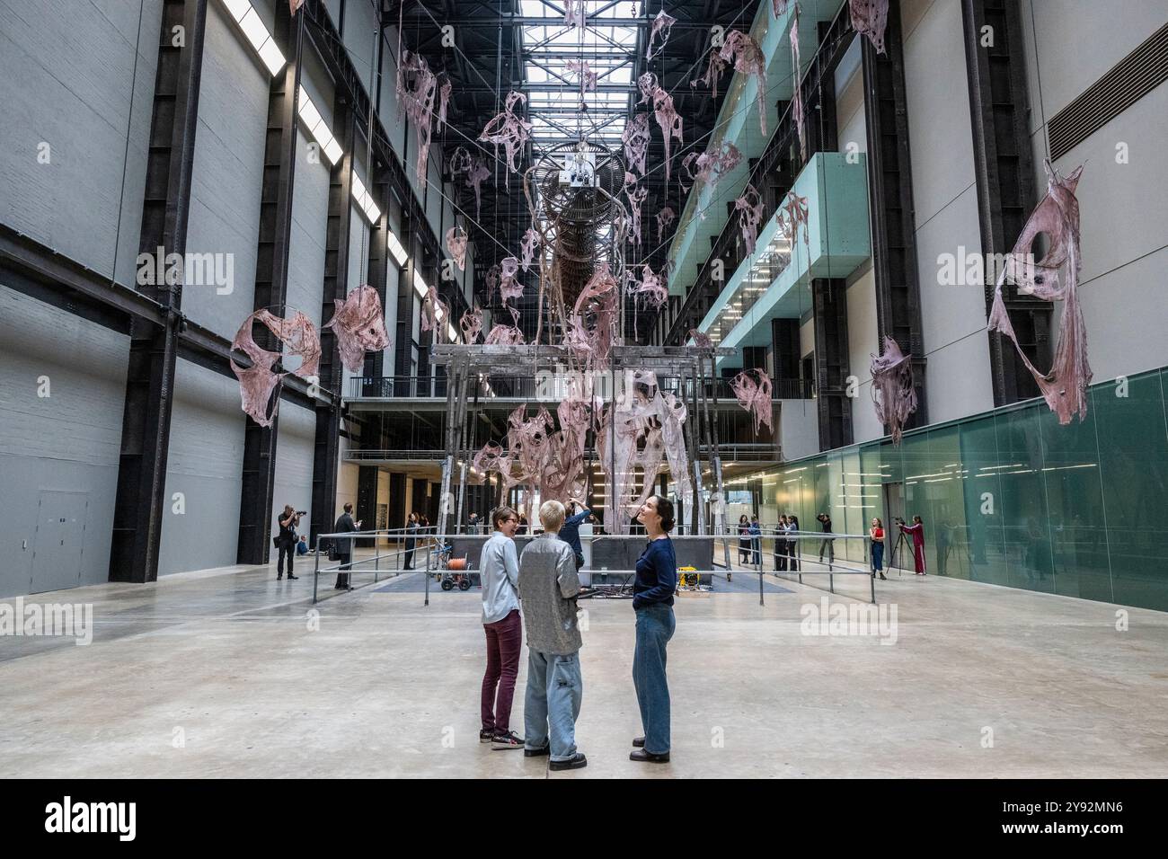London, UK. 8 October 2024. Staff at the unveiling of ‘Open Wound’ by ...