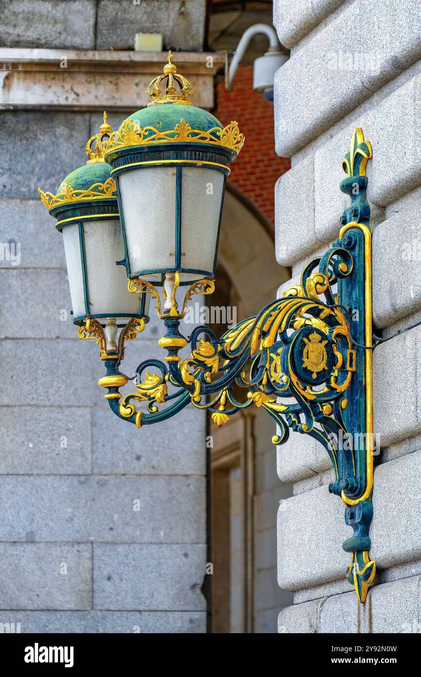 Side view of an ancient lamp mounted on an exterior wall of the Royal ...
