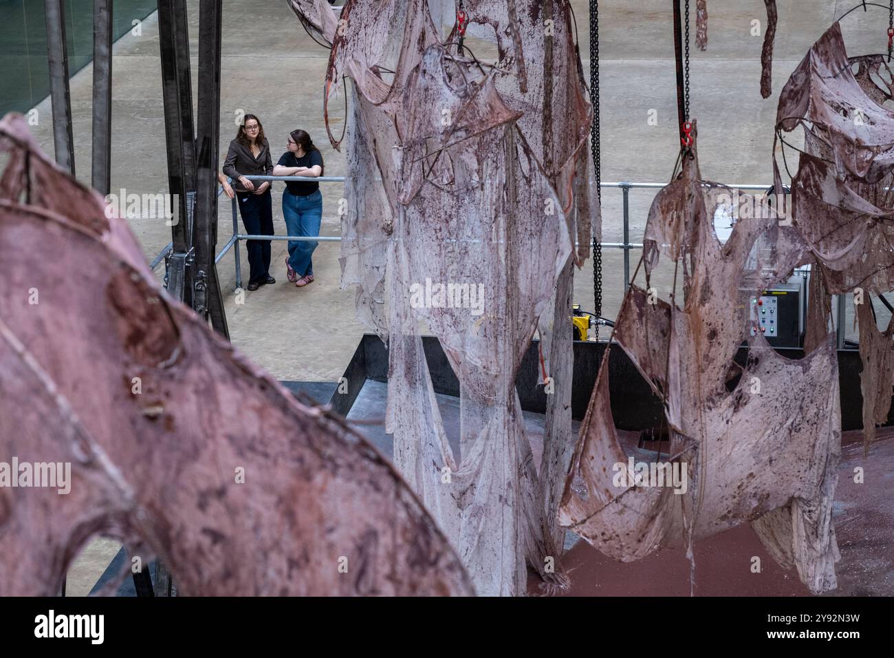 London, UK. 8 October 2024. Staff at the unveiling of ‘Open Wound’ by ...