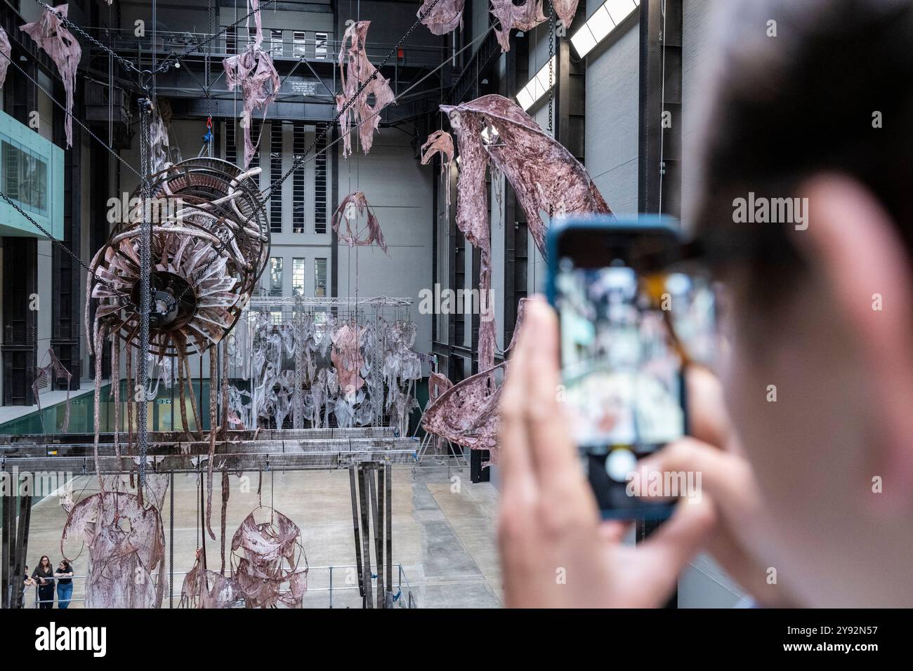 London, UK. 8 October 2024. Staff at the unveiling of ‘Open Wound’ by ...
