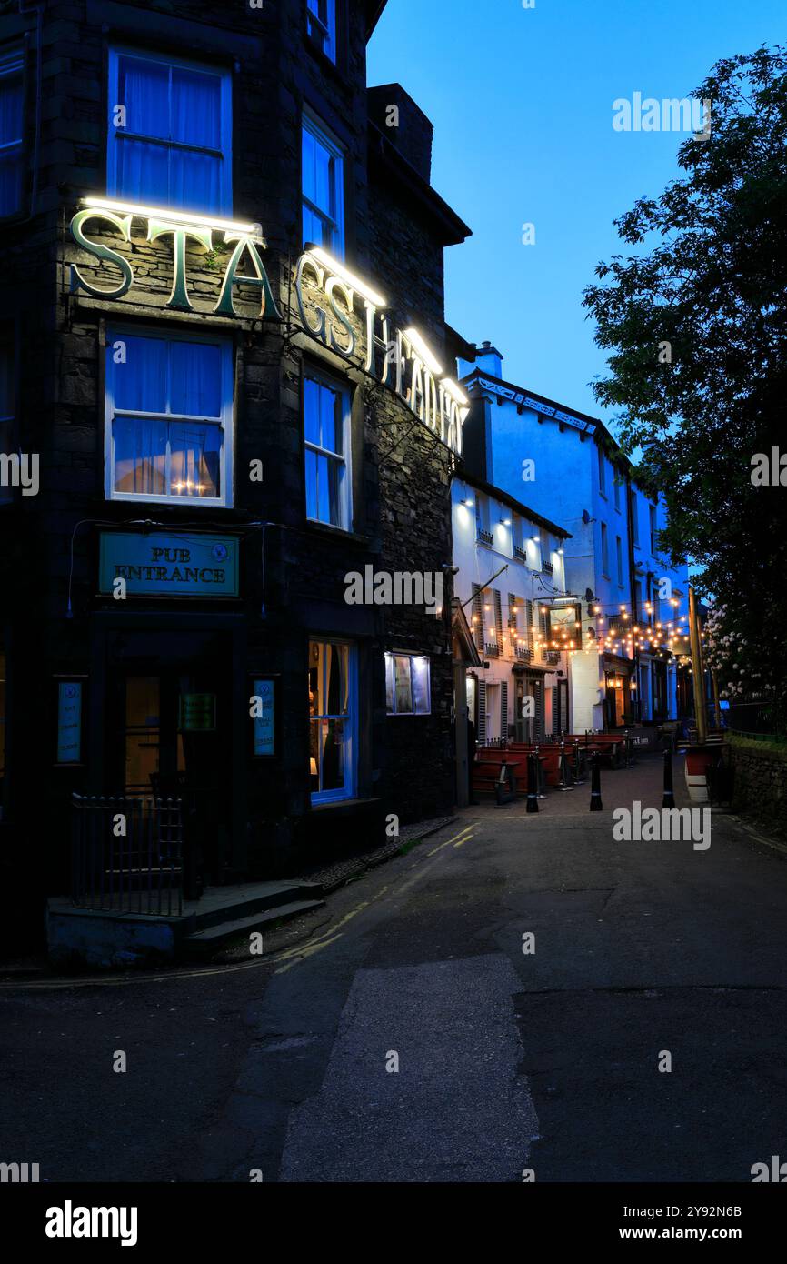 Dusk view of the Stag Head hotel, Bowness on Windermere town, Cumbria ...