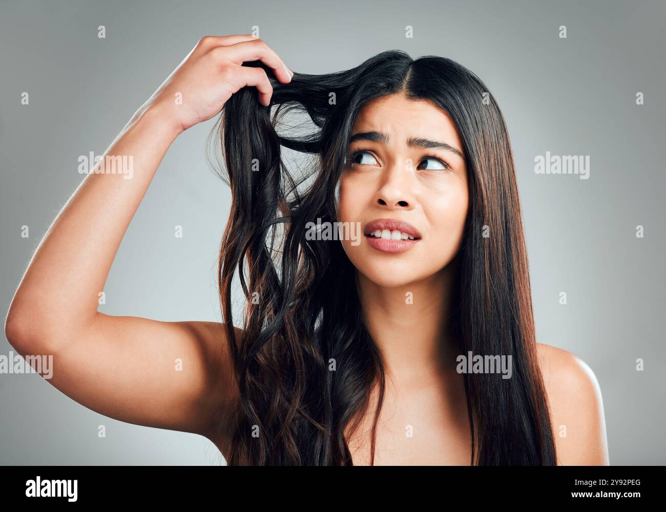 Woman, hair care and thinking with damage in studio, stress and ...