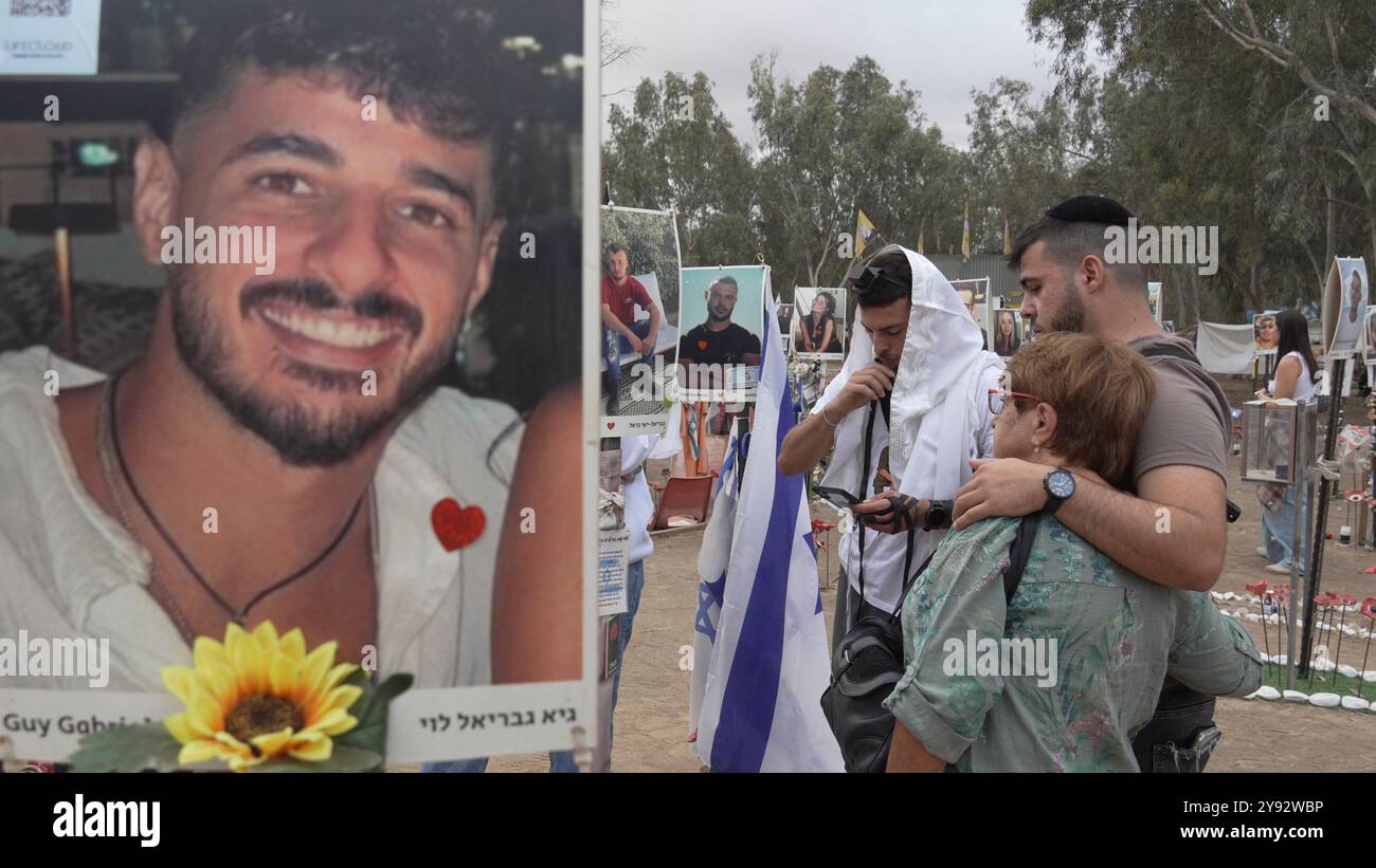 RE'IM, ISRAEL - OCTOBER 7: An Israeli man wrapped with a Talit shawl ...