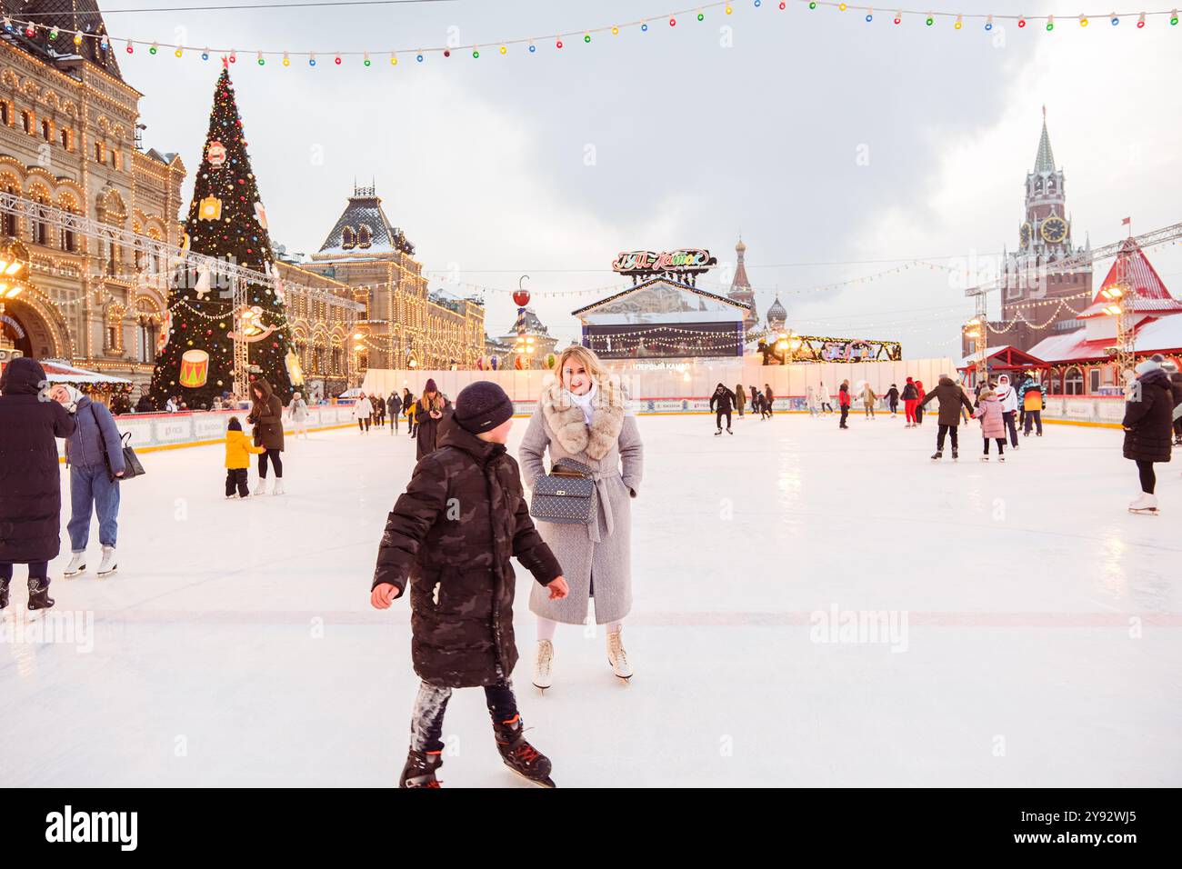 Mother and son on the skating rink on Red Square 2021 Stock Photo - Alamy