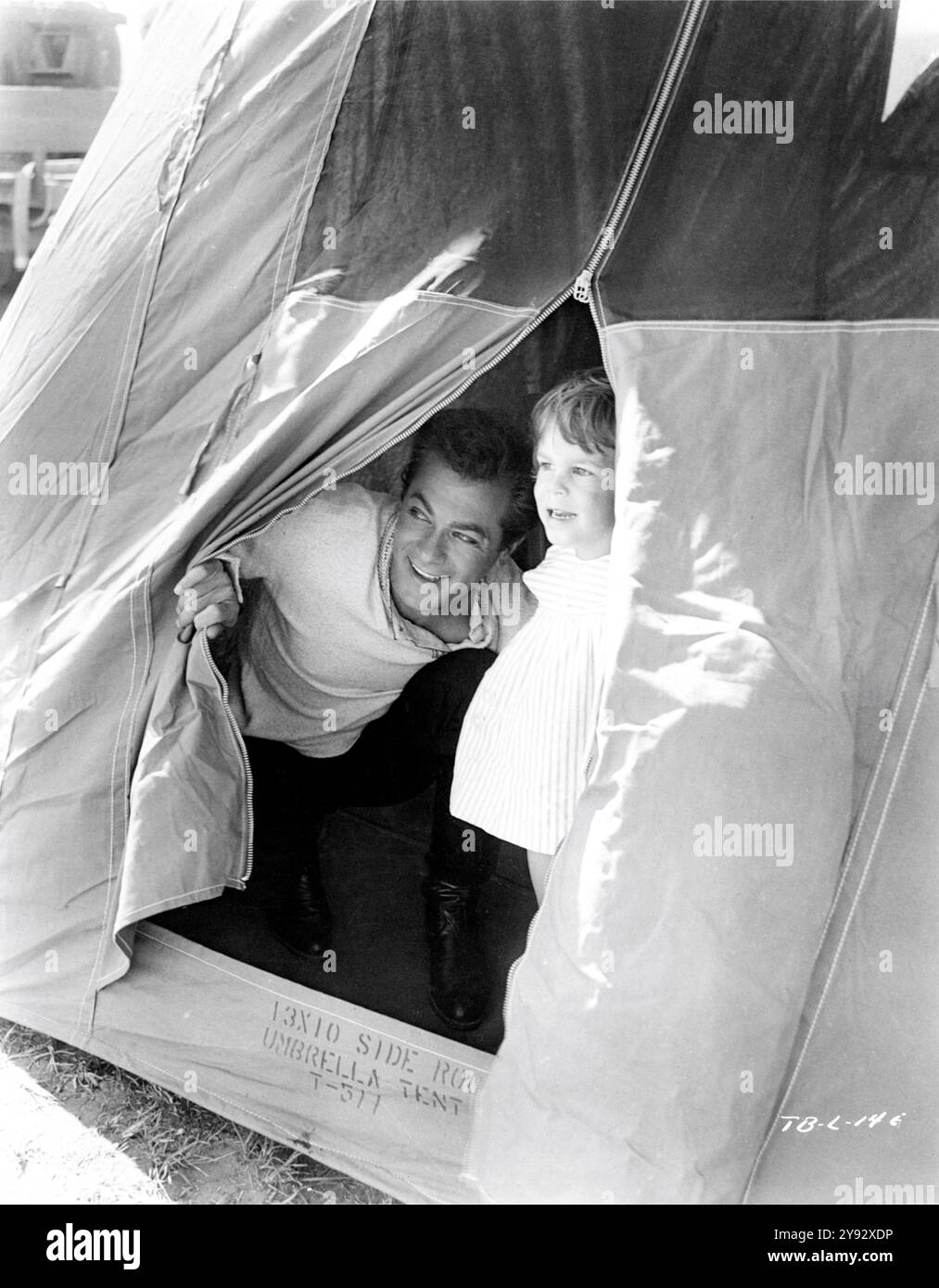 TONY CURTIS and his daughter JAMIE LEE CURTIS in umbrella tent on set ...