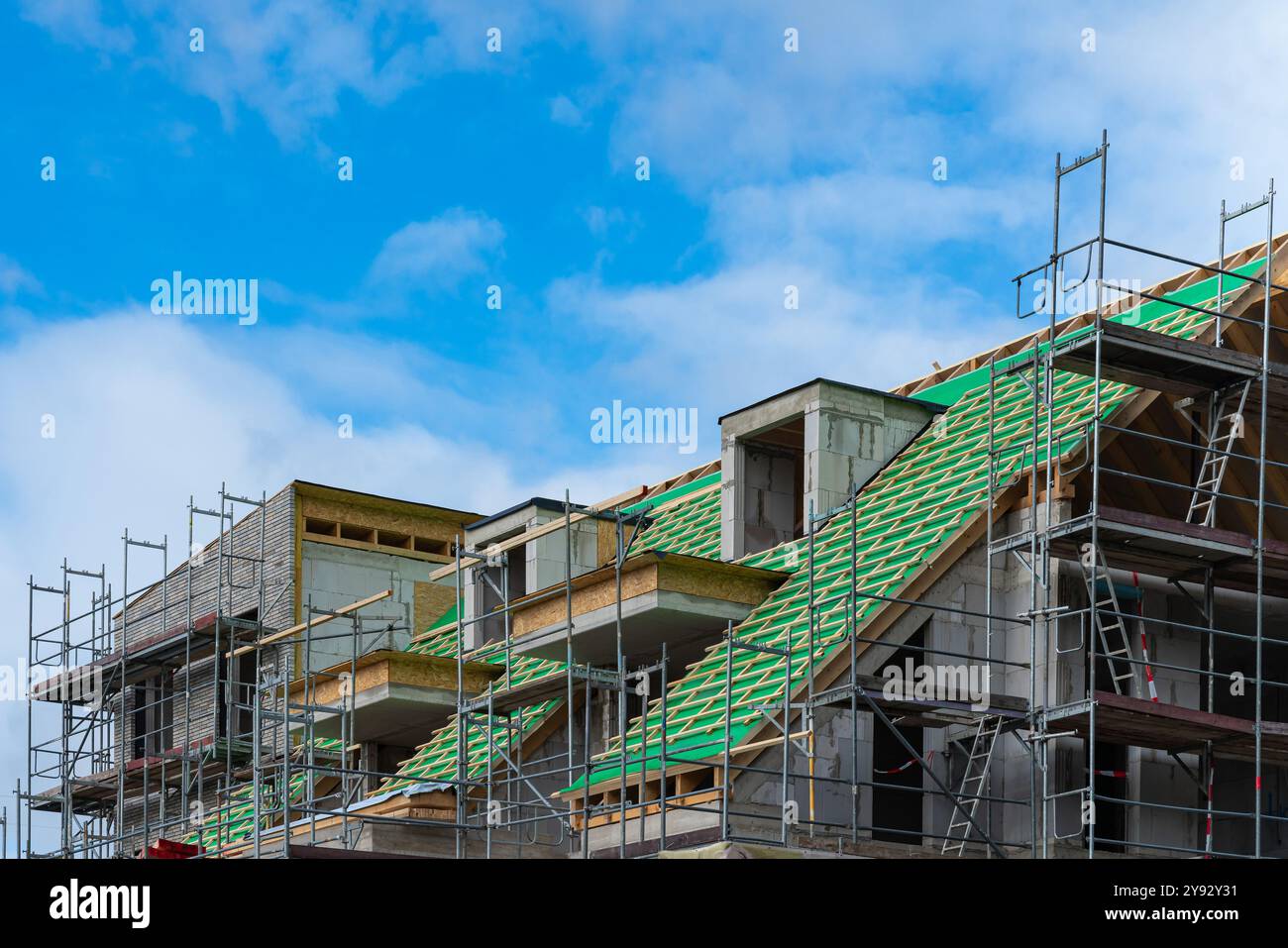 A partially constructed building showcases its structure supported by ...