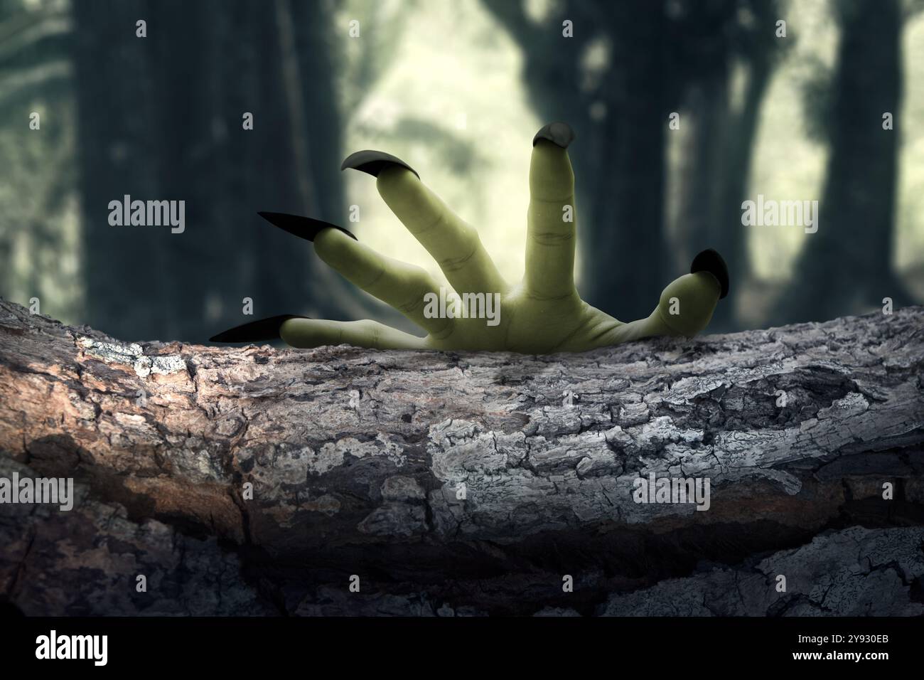 Witch hand with long nail claw reaching out from a wooden log. Scene is ...
