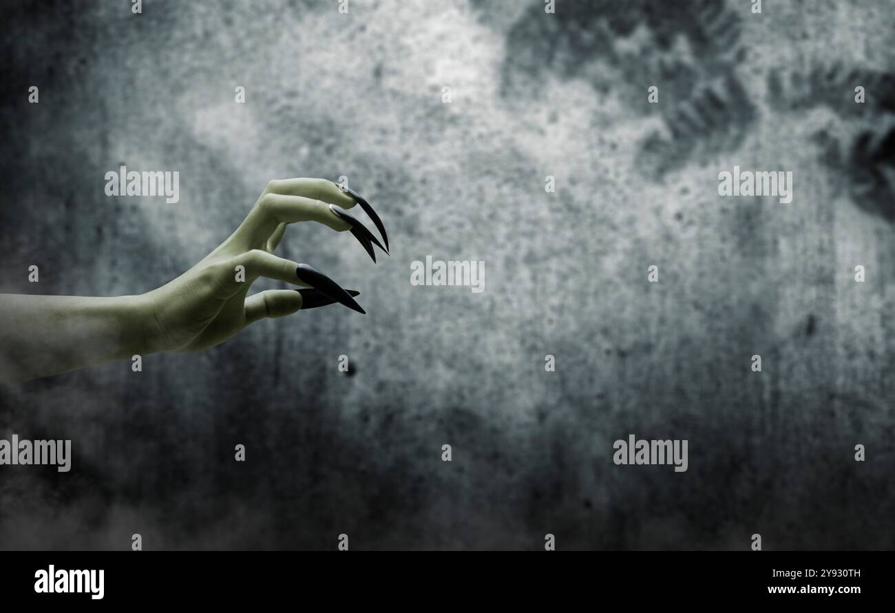 Witches hand with long nail claw is reaching out. The color is green ...